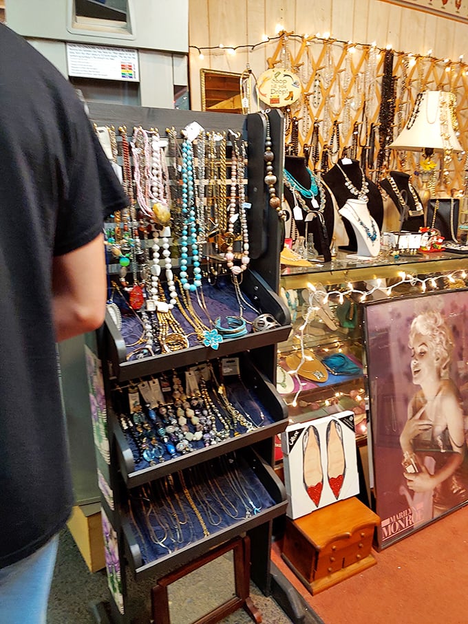 Costume jewelry gleams beside icons of bygone glamour. Marilyn watches over baubles that once adorned women hoping to capture her magic.