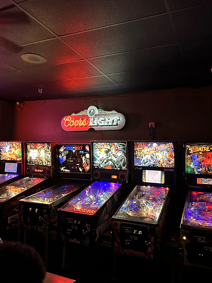 A row of pinball machines stands sentry – mechanical time capsules awaiting quarters and providing the soundtrack to countless first dates.