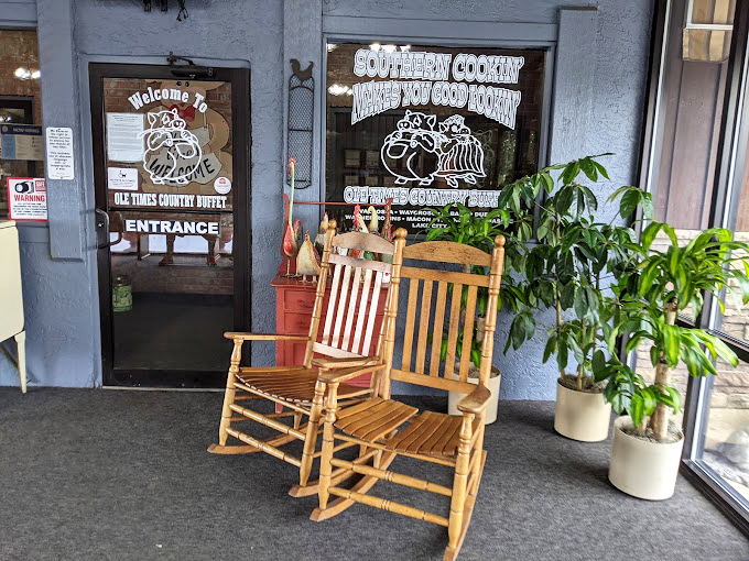 Rocking chairs on the porch say "stay awhile" before you even enter. The sign promises good cookin' and delivers on that promise with Southern hospitality.