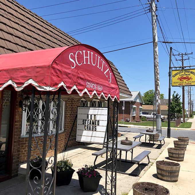 The iconic red awning announces "HOT STEAMED CRABS" like a beacon to hungry souls seeking Maryland's most cherished culinary treasure.