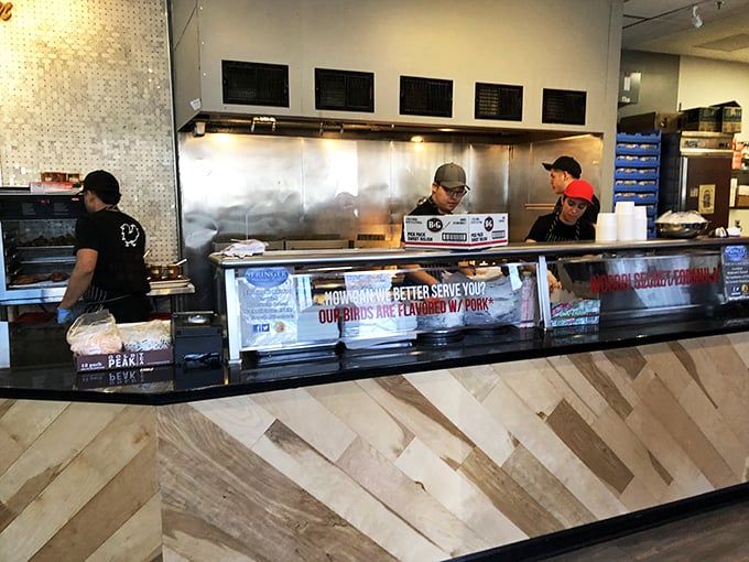 The masters at work behind the counter. These aren't just cooks&mdash;they're heat alchemists transforming humble chicken into gold.