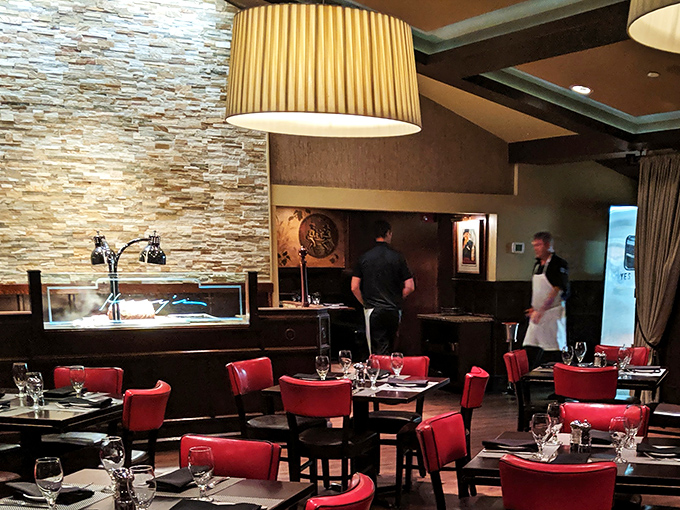 Behind the scenes, culinary magic happens with precision and care. Even the stone wall seems impressed by the professionalism on display.