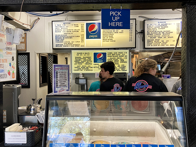 Behind the counter, where the magic happens—staff members orchestrate the daily symphony of orders with practiced efficiency.