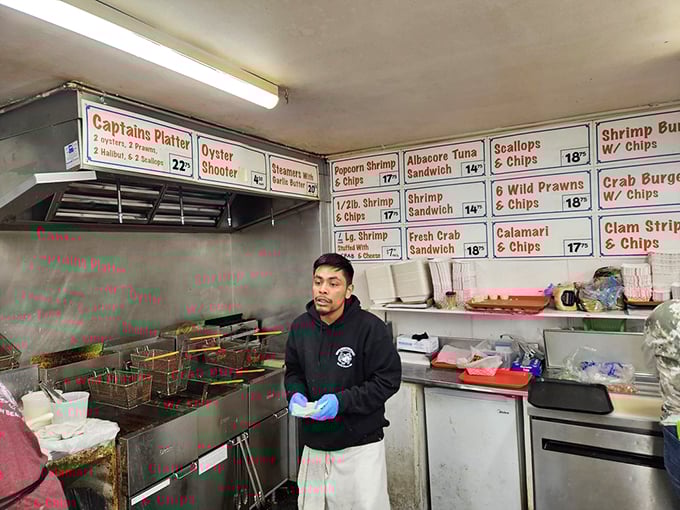 In the kitchen, culinary magic happens with practiced precision. The fryers sizzle with promises of deliciousness.