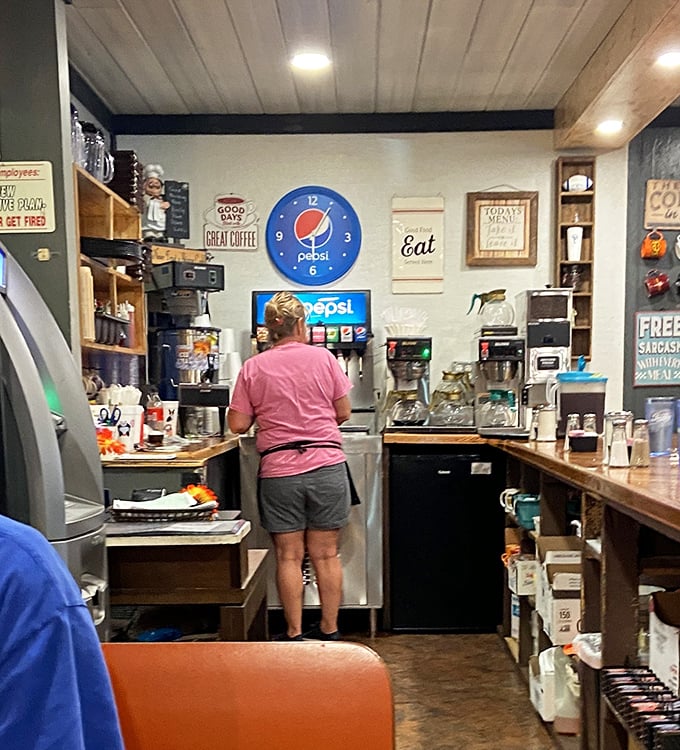 Behind every great diner is someone who knows exactly how many coffee pots need to be brewing at 7:30 AM. The pink shirt isn't uniform&mdash;it's personality.