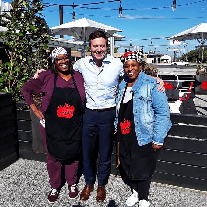 I see people enjoying the outdoor seating area, where the only thing better than the barbecue is sharing it with others.