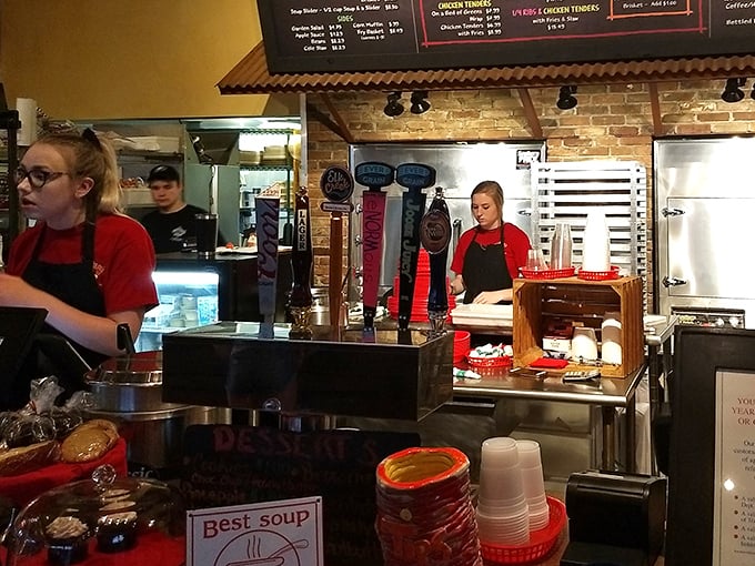 Behind the counter, where barbecue magic happens. The staff works with the focused precision of pit masters who know their craft.
