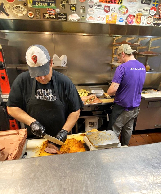 The maestros at work, slicing brisket with the focus and precision of diamond cutters. This is craftsmanship you can taste.