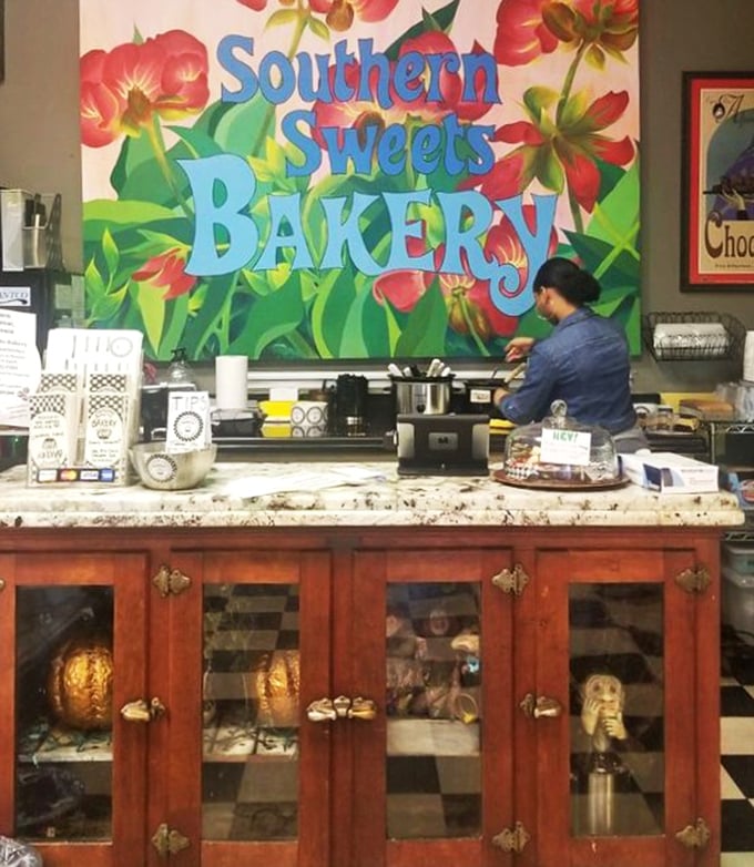 Behind that vibrant floral mural, magic happens. The counter staff aren't just serving desserts&mdash;they're distributing happiness one slice at a time.