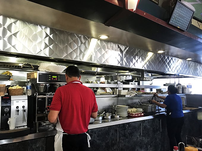 The kitchen crew works their magic behind the scenes. Like culinary conductors orchestrating a symphony of comfort food classics.