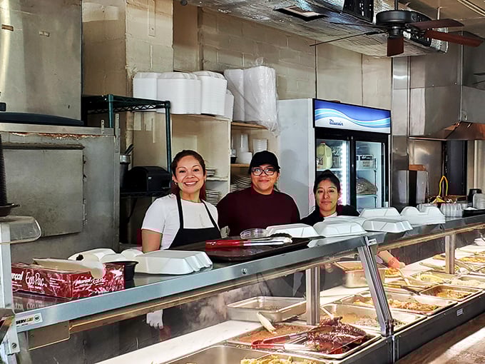 The serving line staff&mdash;the gatekeepers of comfort&mdash;ready to load your plate with portions that say "we care about you."