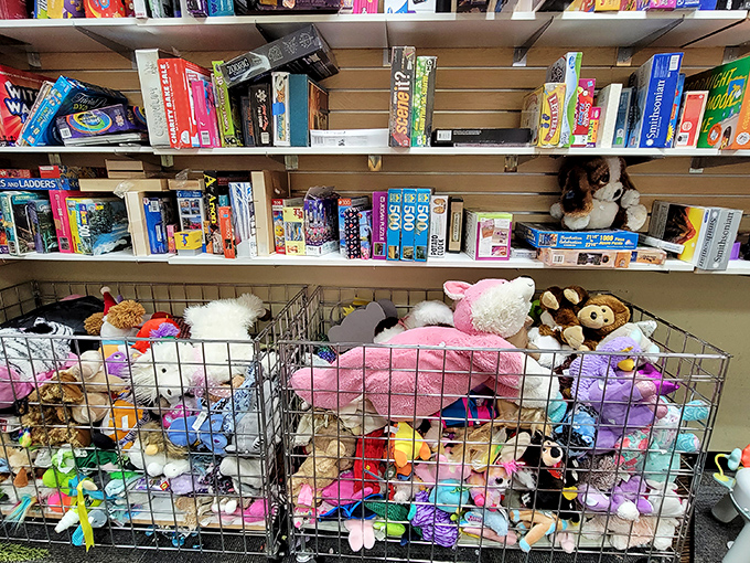 Stuffed animals crowd together in wire bins like passengers on a rush-hour subway, each hoping to catch a child's eye.