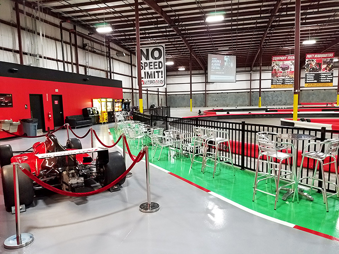 The green zone: where spectators sip drinks, swap excuses, and strategize comebacks while watching others take the curves they just wiped out on.