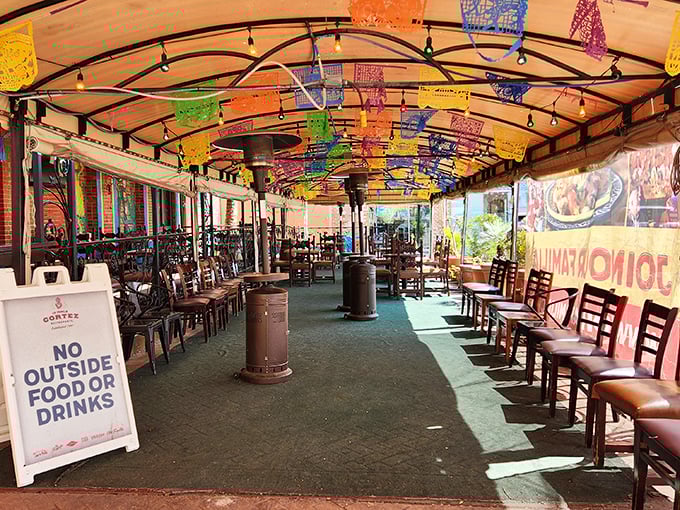 The covered patio area, festooned with colorful papel picado&mdash;where waiting for a table becomes part of the experience rather than a chore.