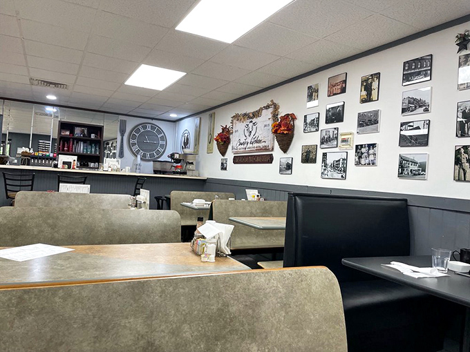 The wall of memories tells stories the menu can't. Each photo frame is a chapter in the community cookbook that is Grandma's Kitchen.
