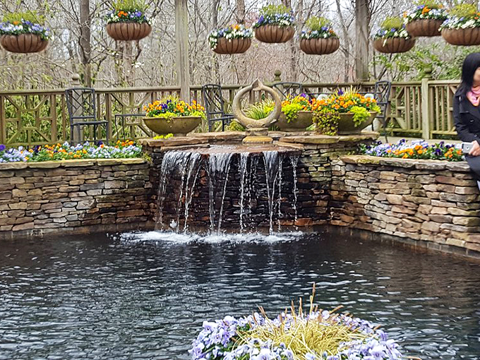Who needs meditation apps when you have this? Water cascades over stone walls while flower-filled planters add pops of color to soothe your soul.