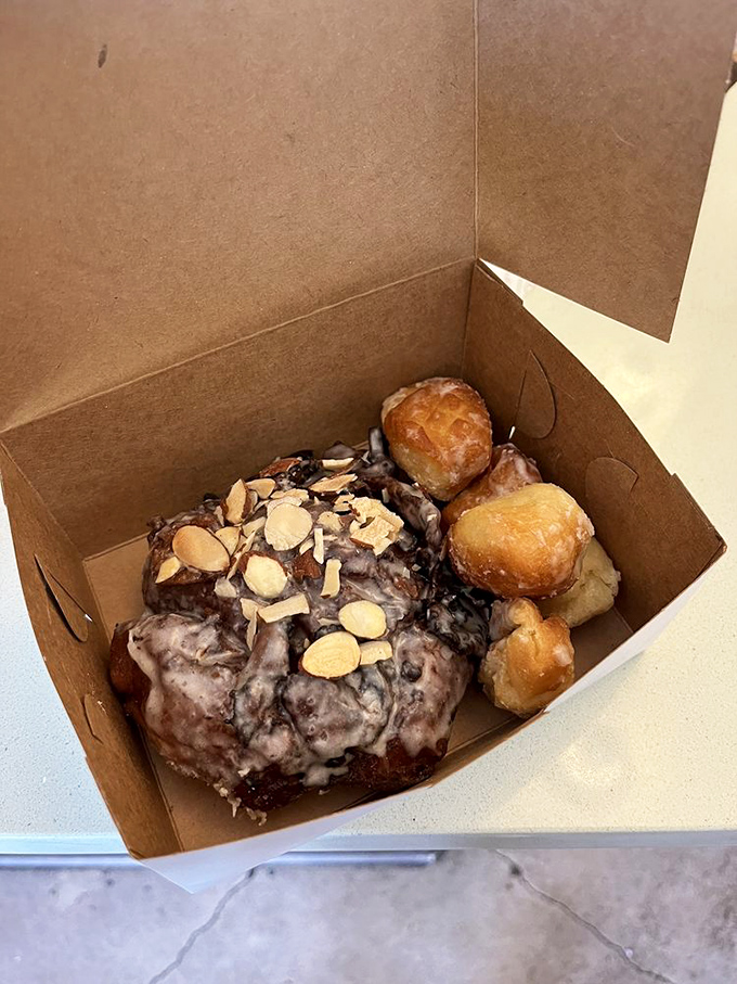 A treasure chest of fried dough, sliced almonds, and chocolate glory that makes you wonder why anyone bothers with traditional birthday cake.