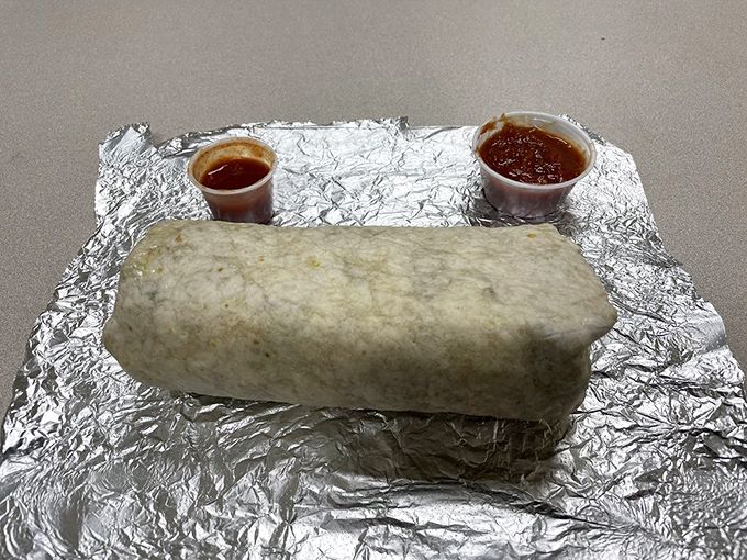 Behind the counter, blue walls and wooden paneling create the perfect canvas for donut artistry. "Dr. Smoothies" suggests they care about balance.