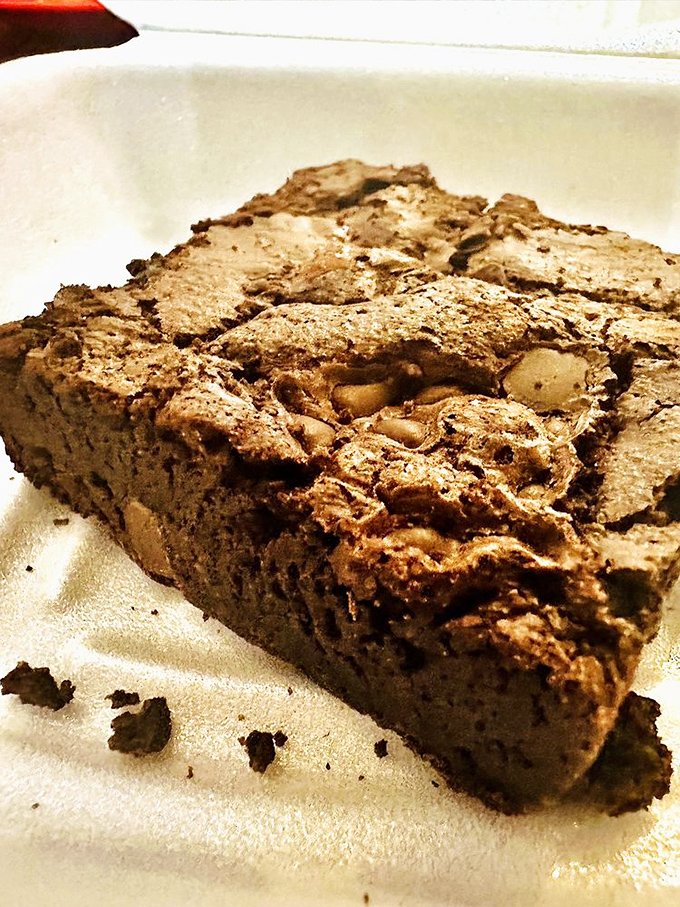 This brownie isn't just dense – it's got depth of character. The kind of chocolate square that demands a cold glass of milk.