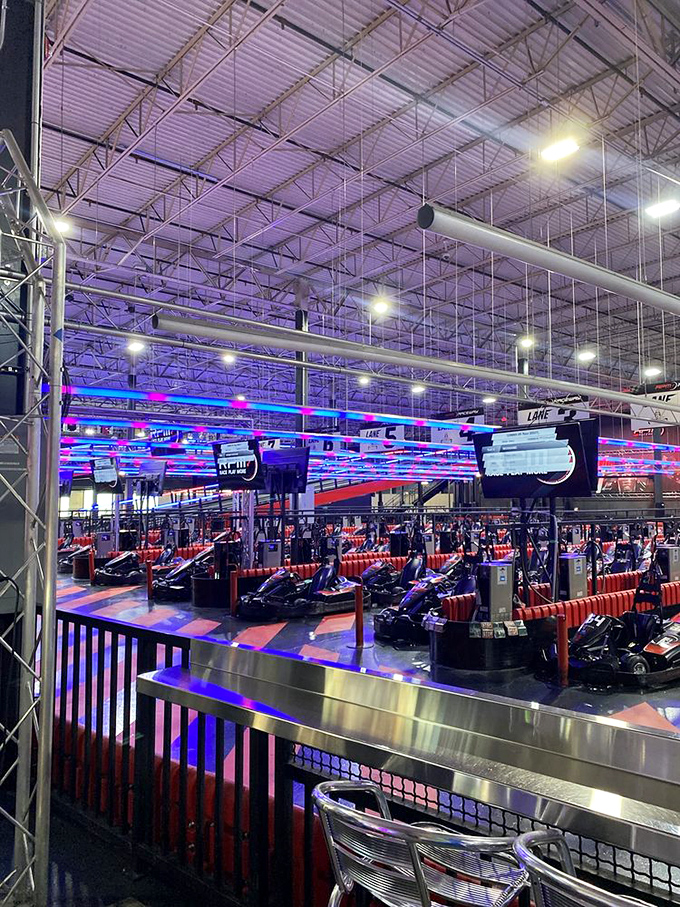 The cavernous space hums with electric anticipation, as drivers mentally prepare to battle for bragging rights and temporary glory.