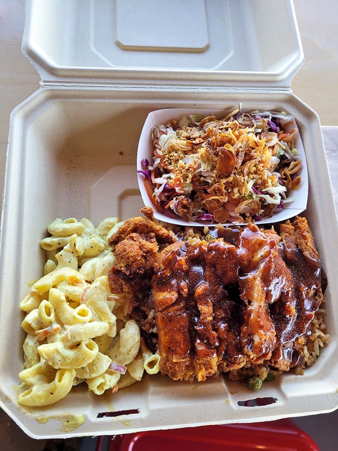 Comfort food fusion that works brilliantly &ndash; crispy katsu, creamy mac, and fresh slaw create the perfect trilogy of textures and flavors.