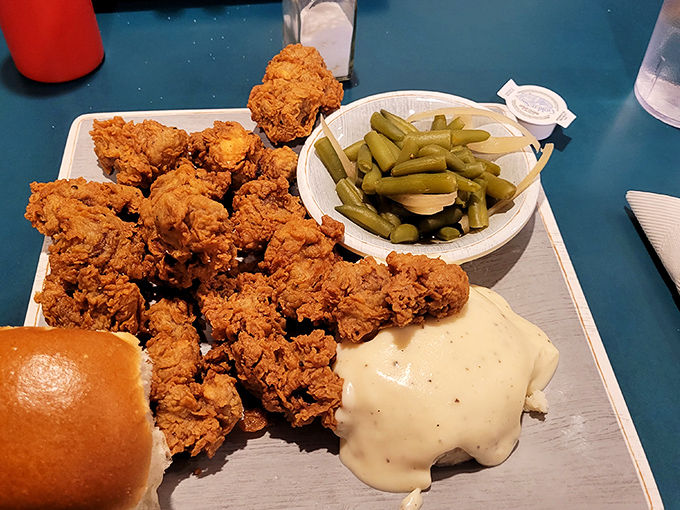 These golden-fried tenders belong in the Comfort Food Hall of Fame. Served with pickles and gravy because Ozark hospitality doesn't do halfway.