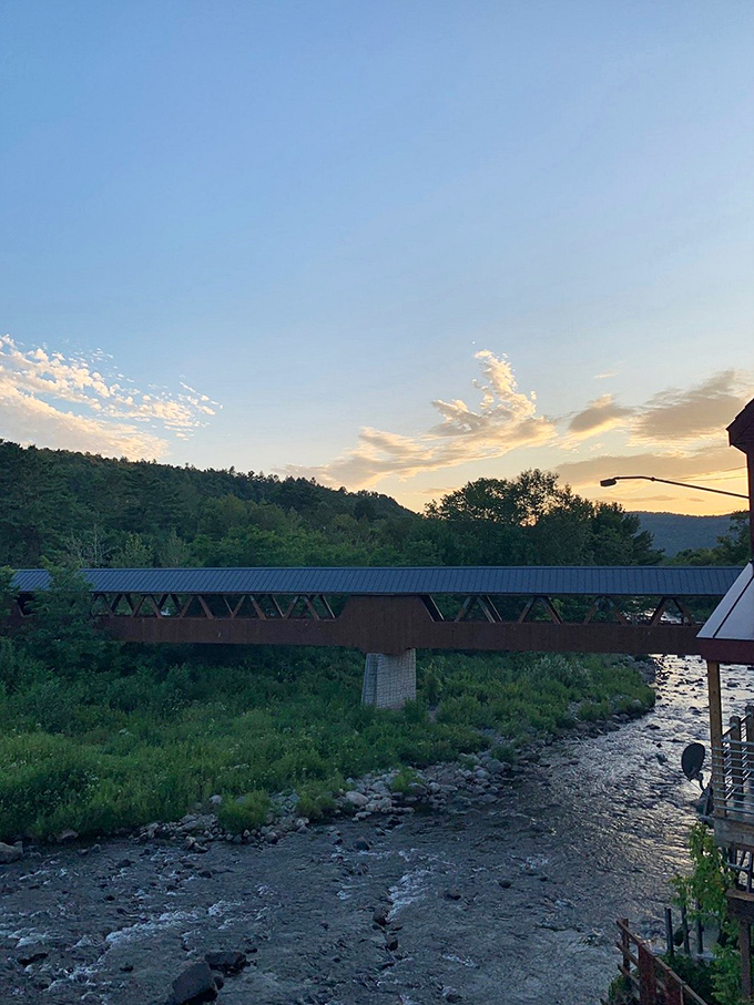 Littleton's covered bridge spans more than just water&mdash;it connects present-day visitors to New England's storied past as sunset paints the scene.
