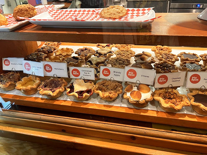 Pie heaven exists, and it looks exactly like this display case. Each little flower-shaped crust holds a different promise of bliss.
