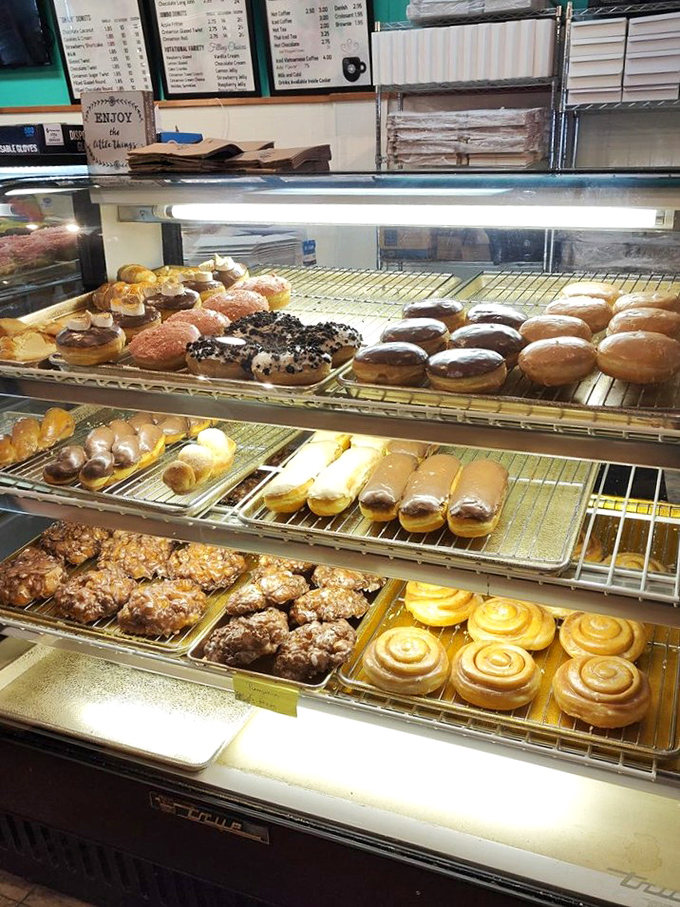 Donut display case: where time stands still, calories don't exist, and "I'll take one of each" becomes a perfectly reasonable request.