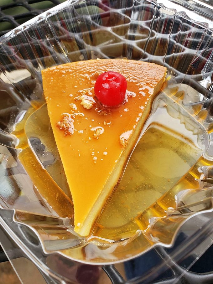 This flan, wearing its caramel crown and cherry hat, has the silky confidence of something that knows exactly how good it is.