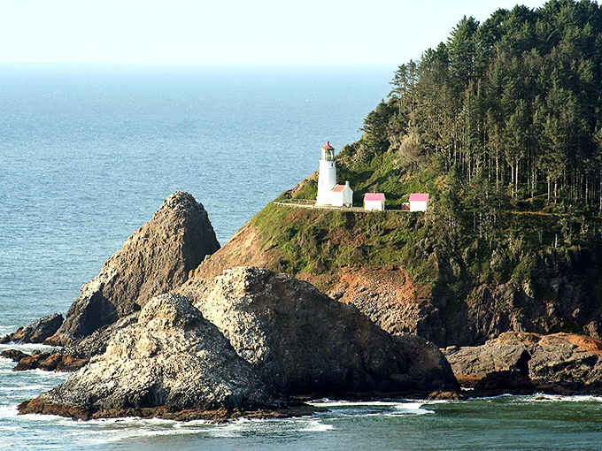 Heceta Head Lighthouse stands watch like a maritime sentinel, its beam having guided generations of sailors through Pacific darkness since 1894.