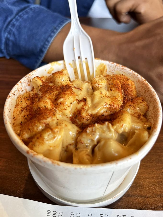 Mac and cheese gets the Nashville treatment! That sprinkle of red spice transforms a childhood staple into something worth fighting your tablemates for.