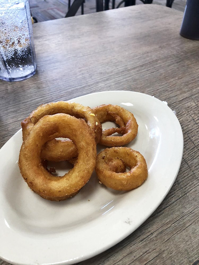 Golden onion rings with that perfect crunch-to-squish ratio&mdash;the unsung heroes of any diner menu and worth every extra minute on the treadmill.