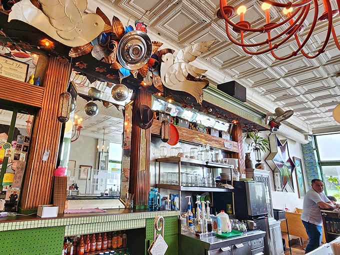 Where kitchen wizardry happens beneath whimsical ceiling decorations that look like they were curated by a benevolent mad scientist.