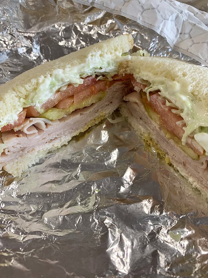 The cross-section of a sandwich reveals the architectural genius within&mdash;layers of turkey and fresh vegetables in perfect harmony.