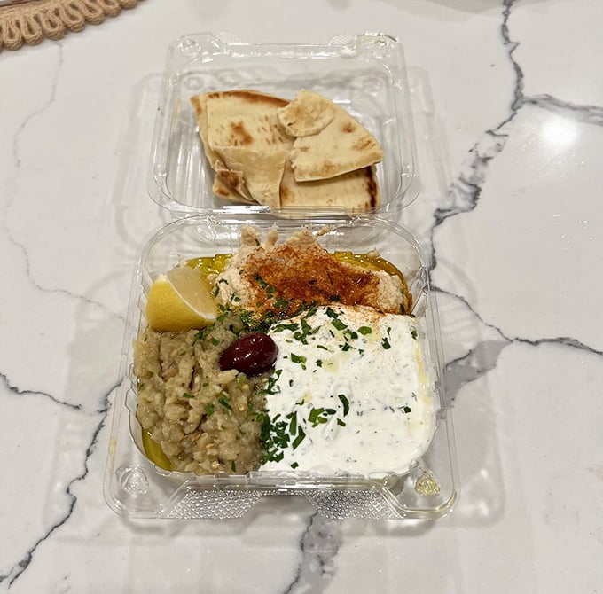 A takeout container of Mediterranean greatest hits&mdash;the kind of spread that makes you feel like you're dining like Zeus.