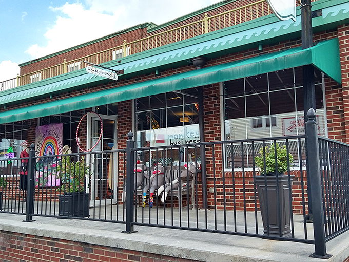 A Little Monkey Business offers whimsical treasures behind iron railings. The colorful storefront practically guarantees you won't leave empty-handed.