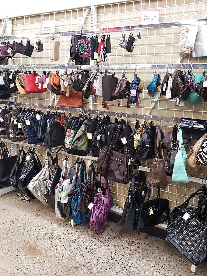 Handbag heaven for the accessory obsessed. Like a leather and vinyl forest, these purses hang in suspended animation until the right shoulder comes along.