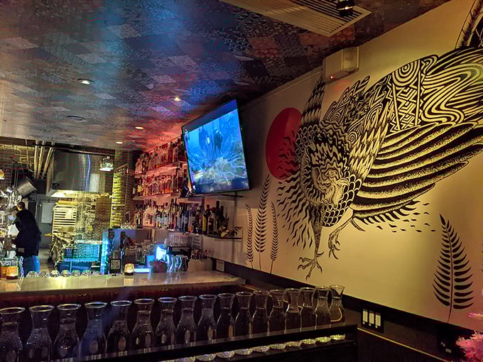 The bar area sports an artistic chicken mural that watches over patrons like a funky guardian spirit of good times and proper libation choices.