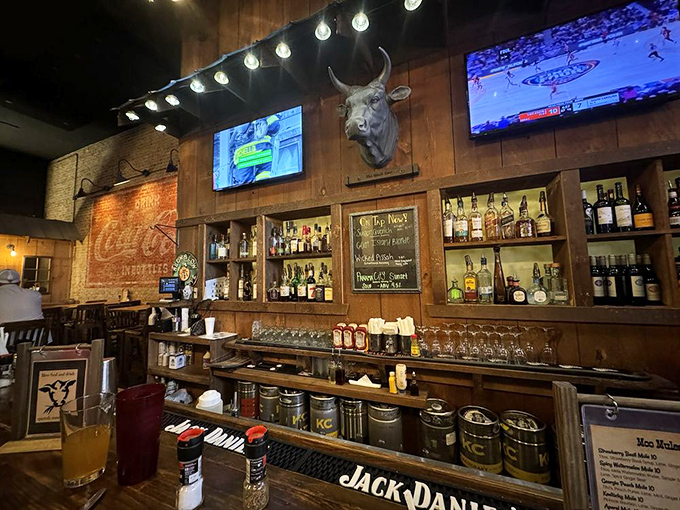 The bar isn't just serving drinks&mdash;it's offering liquid punctuation marks for conversations that matter, all under the watchful gaze of a mounted bovine.