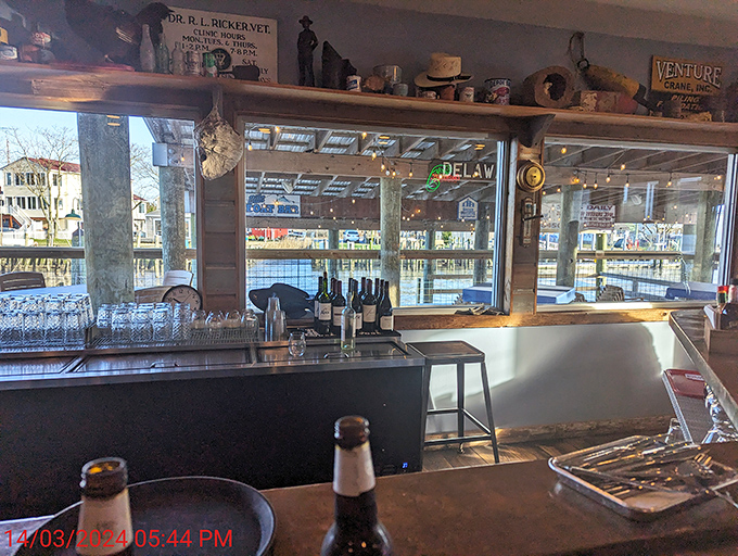 The bar area offers a front-row seat to waterfront views, with vintage maritime treasures lining the shelves above&mdash;liquid refreshment with a side of nostalgia.