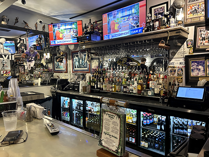 A bar stocked for serious business, where sports memorabilia watches over proceedings like saints guarding a particularly spirited congregation.