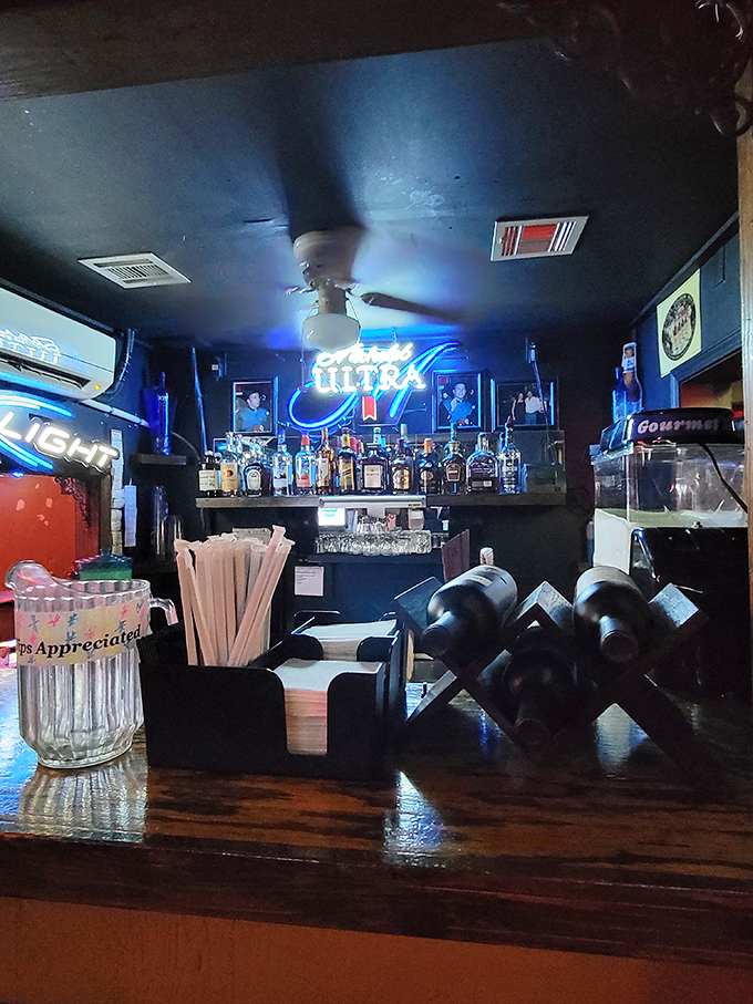 The bar area glows with liquid possibilities. "Tips Appreciated" isn't just a suggestion&mdash;it's the proper response to this level of hospitality.