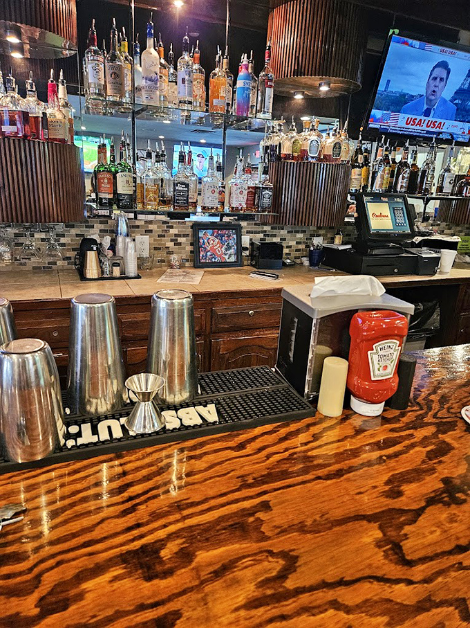 The fully-stocked bar isn't just serving drinks; it's offering liquid personality traits to complement your food choices.