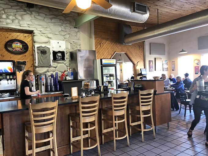 The bar area balances rustic charm with modern convenience&mdash;the perfect perch to enjoy a local brew while waiting for pizza perfection.