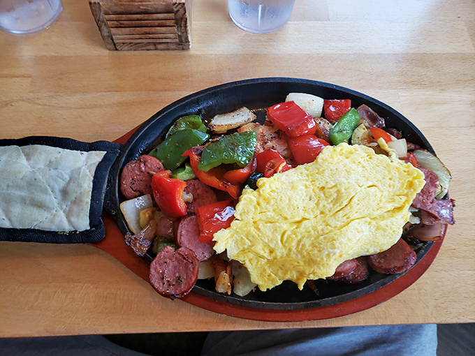 This skillet doesn't just contain breakfast&mdash;it's hosting a flavor convention where eggs, sausage, and peppers are all keynote speakers.