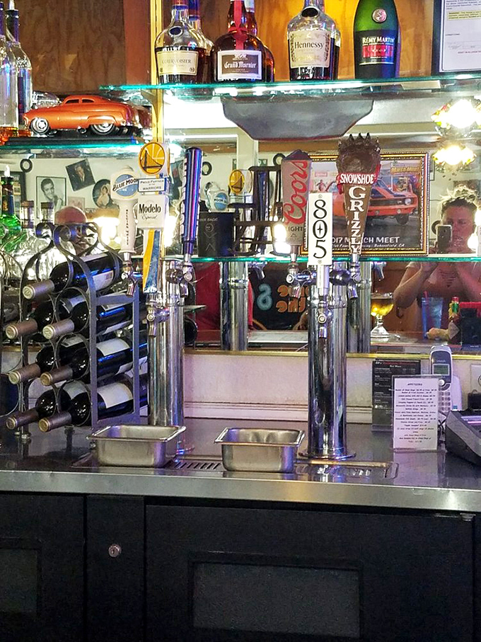 Behind every great roadhouse is a great bar setup. These taps stand ready to pour liquid happiness alongside model cars and memorabilia.