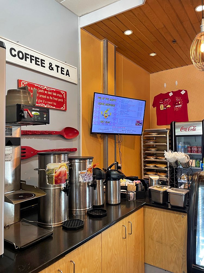 Coffee station that understands its crucial role in the pie ecosystem. Those giant red utensils on the wall are basically saying, "Yes, this is serious business."