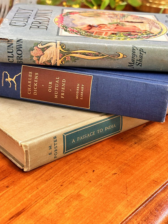 Literary treasures stacked with care&mdash;Dickens, Forster, and Brown keeping each other company through the decades. Words never go out of style.