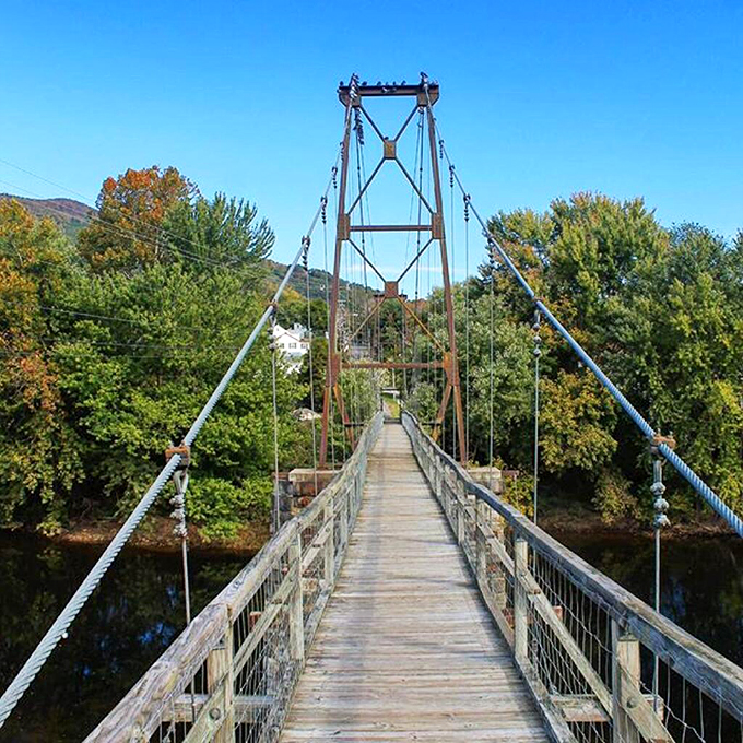 The suspension footbridge near Wellsboro offers both thrills and spectacular views, inviting adventurous souls to cross its wooden planks.